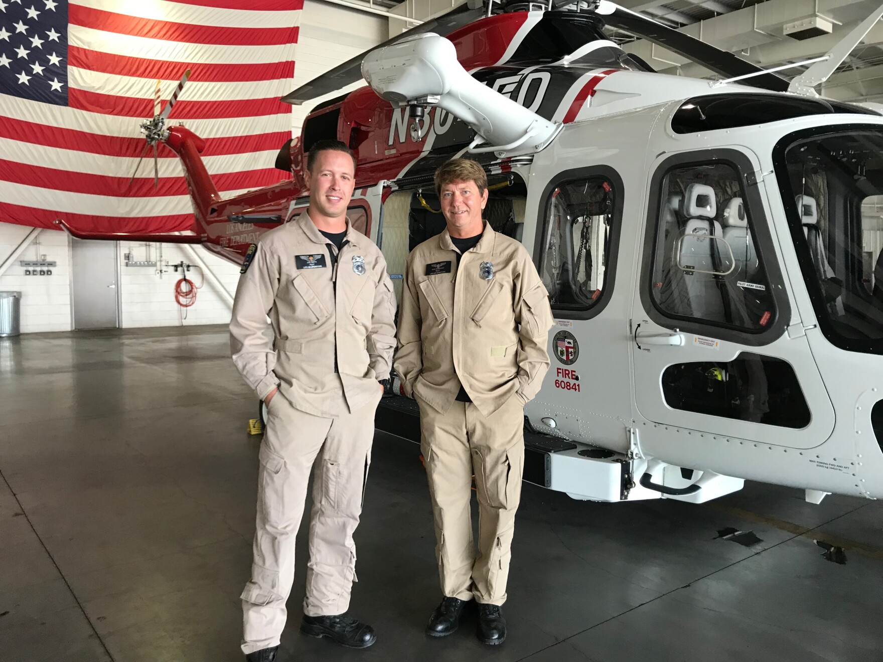 LAFD pilots rescue three people and two dogs from burning hilltop as ...