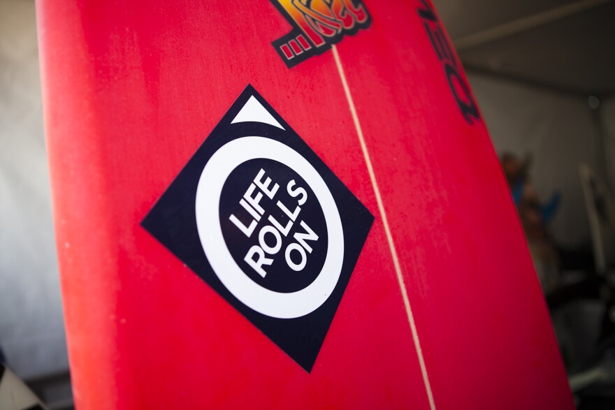 Disabled surfer goes from wheelchair to waves following car wreck | LAist